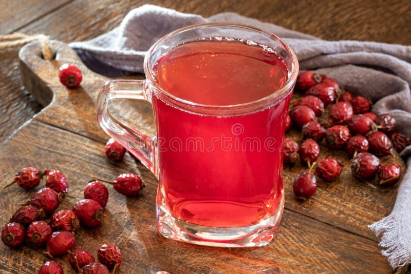 A Cup of Rose Hip Tea with Dried Rose Hips Stock Photo - Image of ...