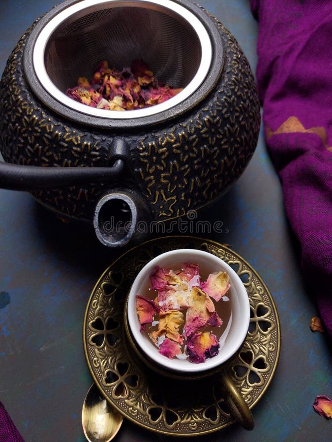 A Cup of Rose Tea with a Metal Tea Pot Stock Photo - Image of asian ...