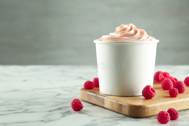 Cup with Tasty Frozen Yogurt and Raspberries on Table. Space for Text ...