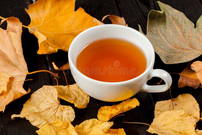 Cup of Tea and Autumn Leaves on the Table Stock Image - Image of food ...