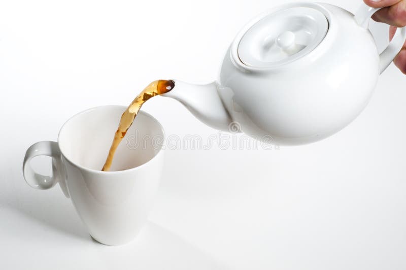 Cup of tea being poured stock photo. Image of teapot - 13444418