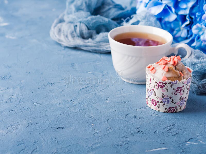 Cup of Tea on Blue Background with Flowers Stock Photo - Image of cake ...