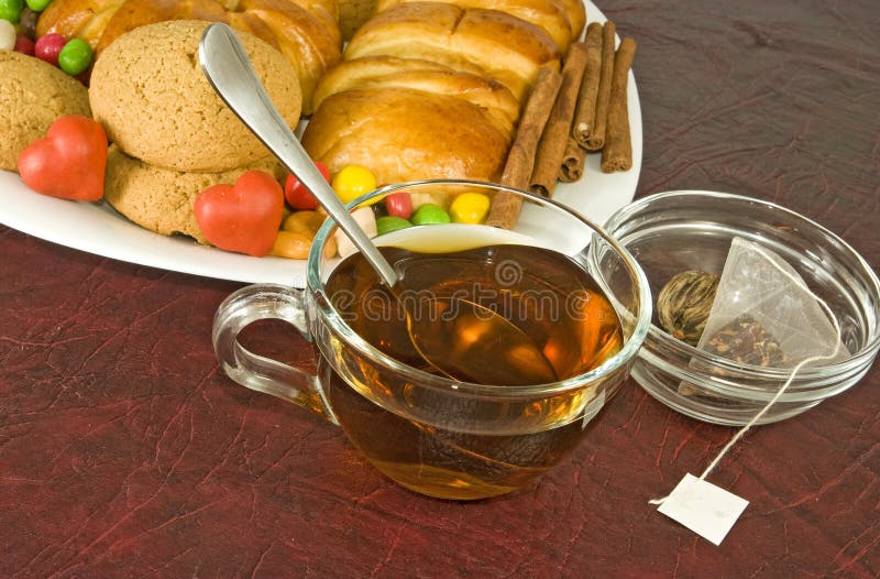 Cup of Tea, Cakes and Buns Closeup Stock Photo - Image of green ...