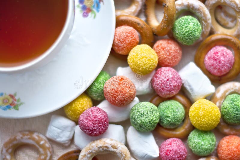Cup of tea with candy stock image. Image of morning, saucer - 63215865