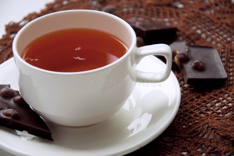 Cup of tea with chocolate stock image. Image of delicious - 37494041