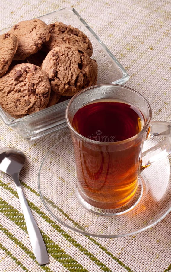 Cup of tea and cookies stock image. Image of spoon, biscuits - 17979883