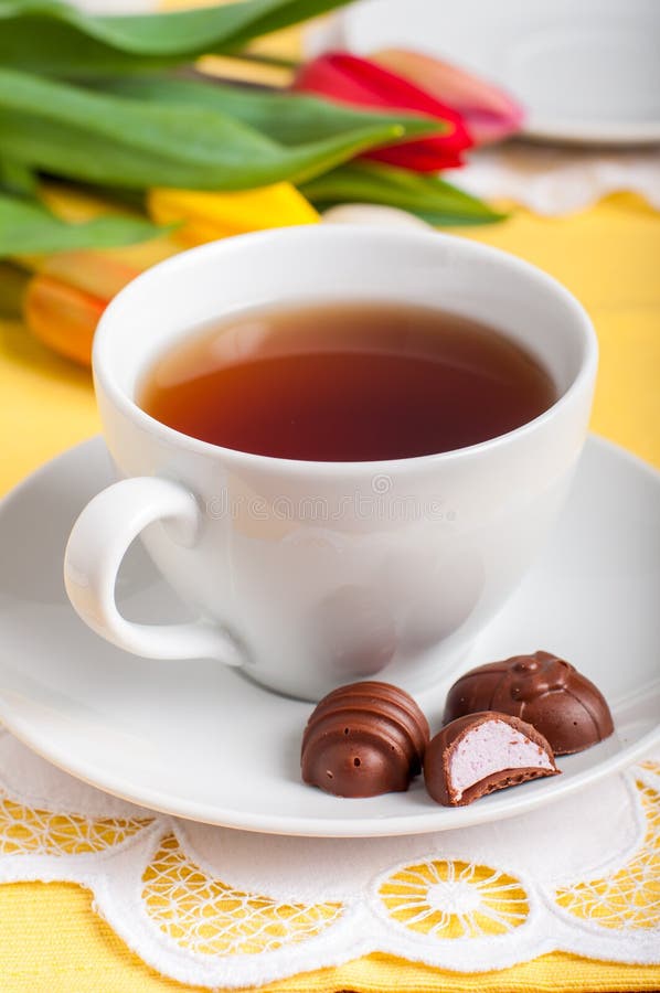 A Cup of Tea with Easter Egg Shaped Chocolate Candies Stock Photo ...