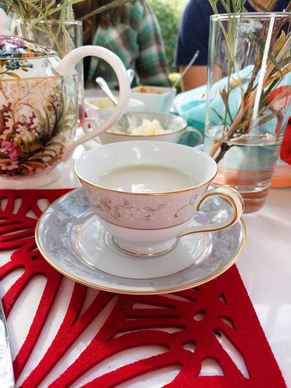 Cup of Tea in Fancy China in Front of an Afternoon Tea Spread Stock ...