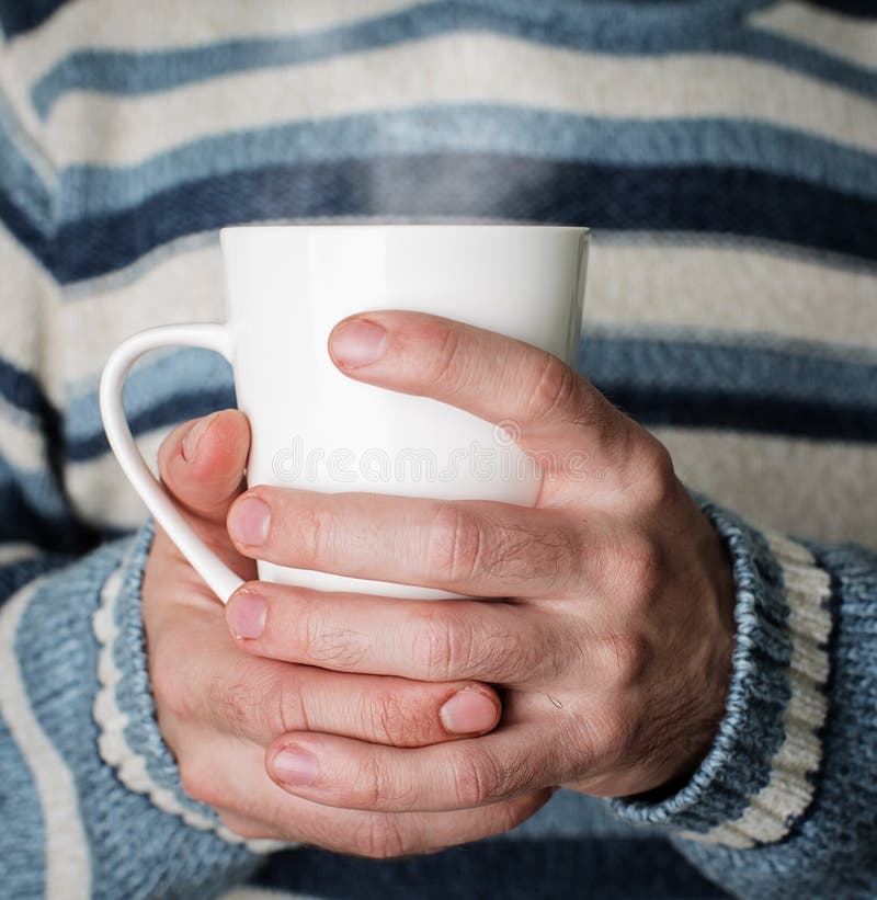 Cup of tea in hand stock image. Image of pour, drink - 60642941