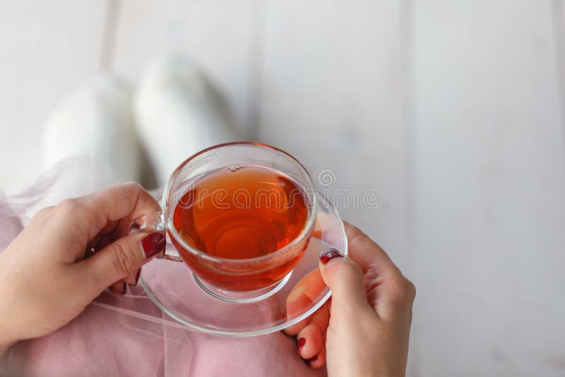 Cup of tea in hand stock photo. Image of colorful, hand - 101050874