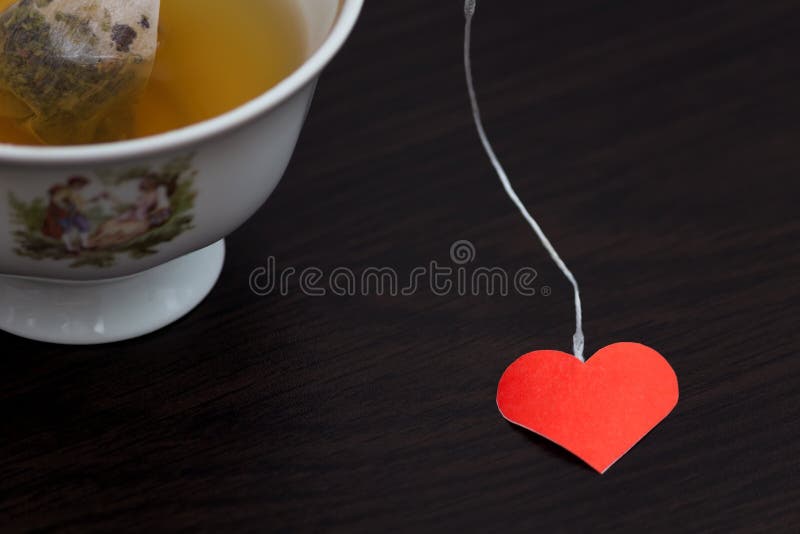 Cup of Tea with Heart Shape on a Black Wooden Table Stock Image - Image ...