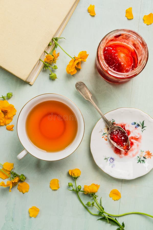 Cup of Tea, Jar with Jam, Book and Yellow Flowers Stock Image - Image ...