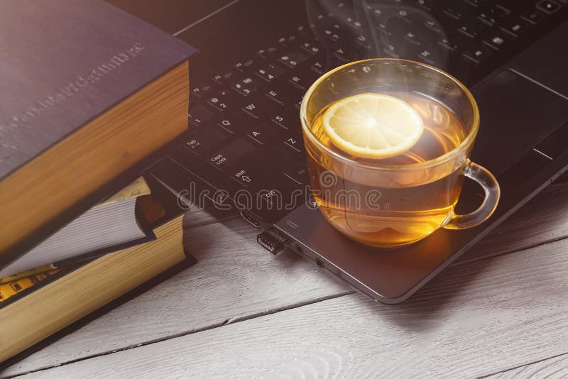 Cup of Tea on Laptop and Book. Relaxing Time Concept Stock Photo ...