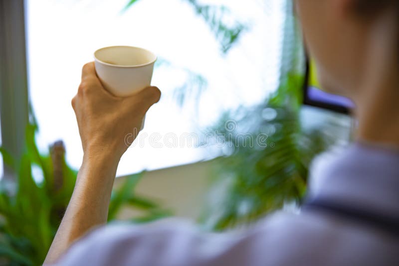 A Cup of Tea with Left Hand in the Office Stock Photo - Image of ...