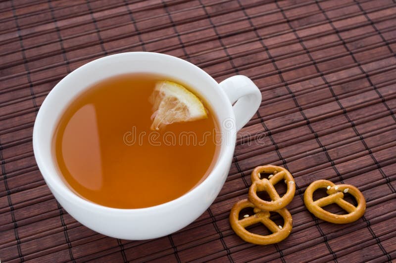 Cup of Tea with Lemon and Cookie a Cracker Stock Image - Image of ...