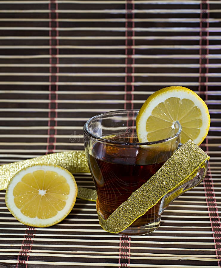 Cup of Tea with a Lemon Wrapped Up by a Gold Tape Stock Image - Image ...