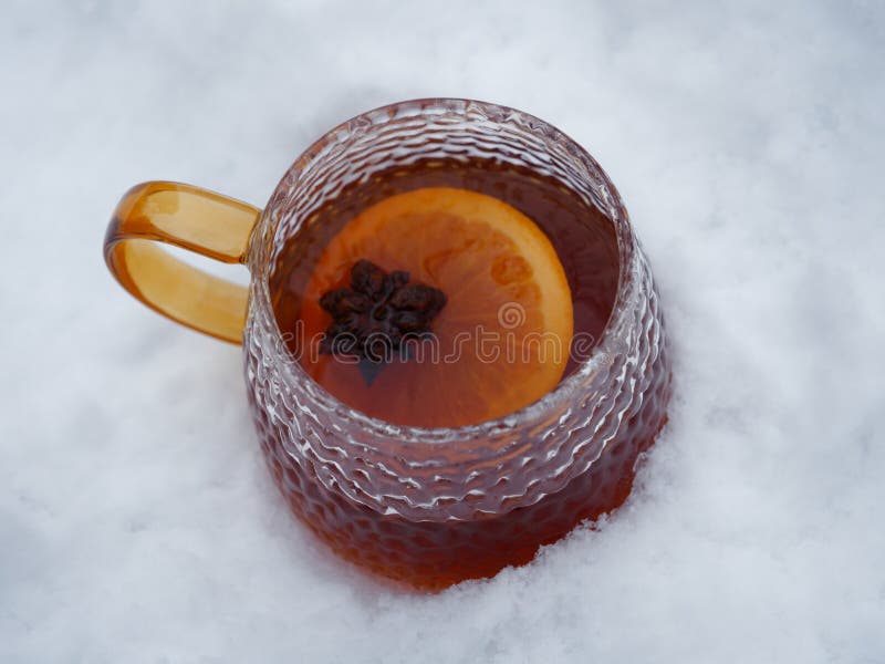 A Cup of Tea with an Orange on the Snow Stock Image - Image of beverage ...