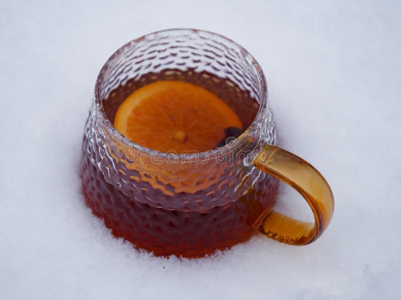 A Cup of Tea with an Orange on the Snow Stock Photo - Image of slushy ...
