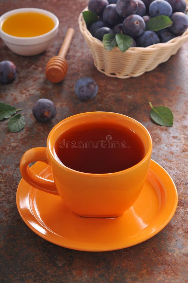A Cup of Tea and Plum on the Table Stock Image - Image of harvest ...