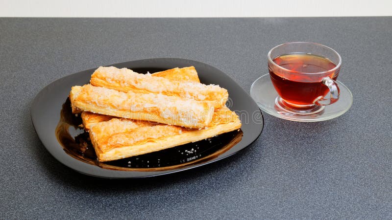 Cup of tea and puff pastry stock photo. Image of breakfast - 58949920