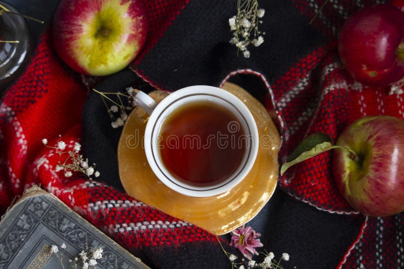 Cup of tea with red apple stock image. Image of home - 123983911