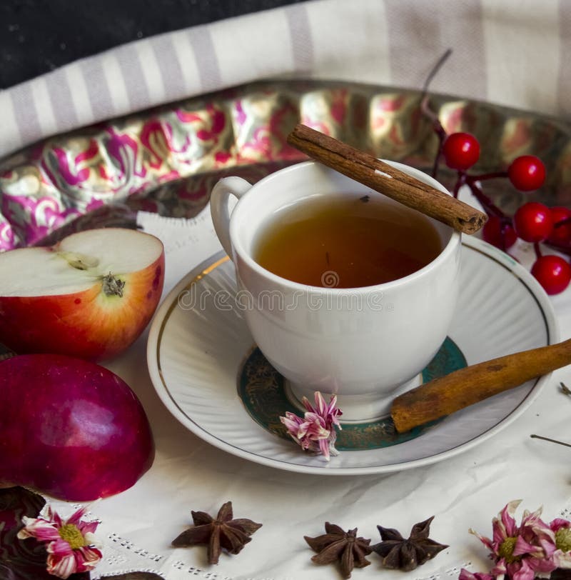 A Cup of Tea with Red Apples and Cinnamon Stock Photo - Image of ...