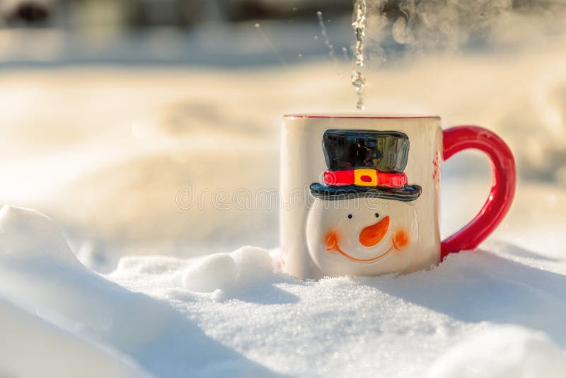 Cup of tea in the snow stock image. Image of thermos - 65357433