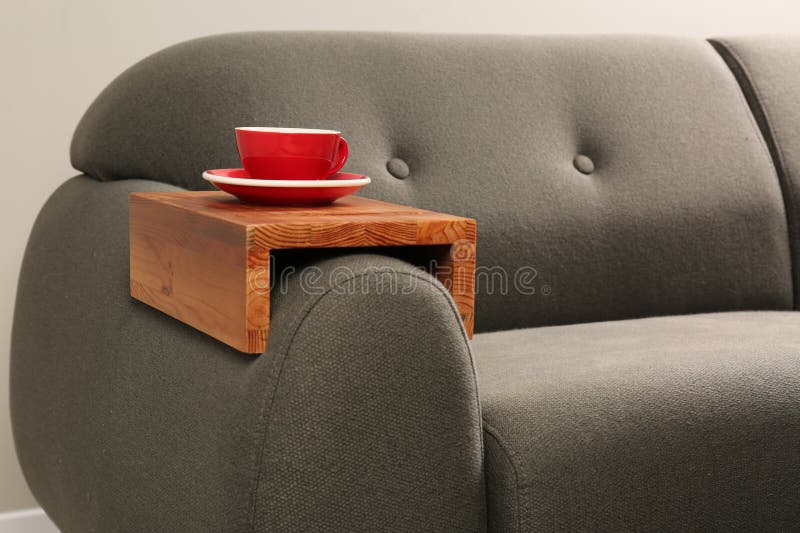 Cup of Tea on Sofa with Wooden Armrest Table in Room. Interior Element ...