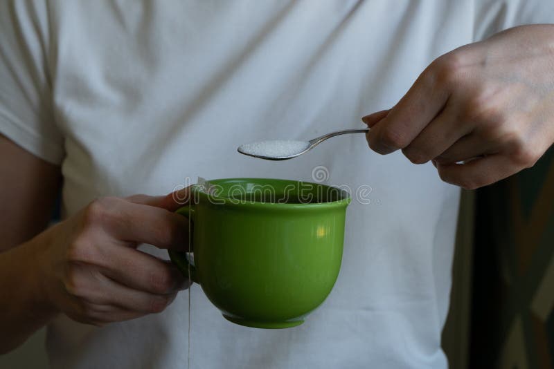 A Cup of Tea and the Spoon with Sugar Stock Image - Image of delicious ...