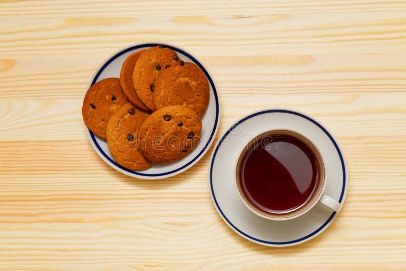 A Stack of Cookies Tied with a Jute Rope. Next To it is a Glass of Milk ...