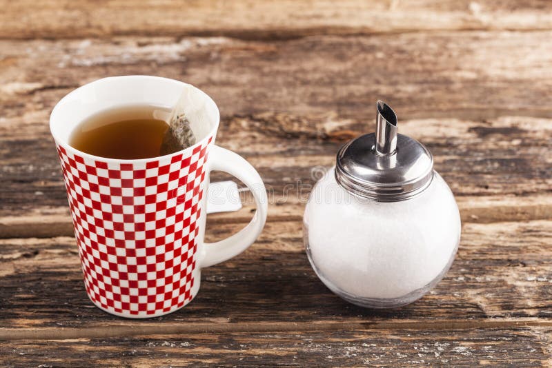 Cup of tea with sugar stock photo. Image of refreshment - 84693784