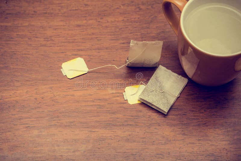Cup of Tea with Tea Bags on Brown Table Background Texture Stock Photo ...
