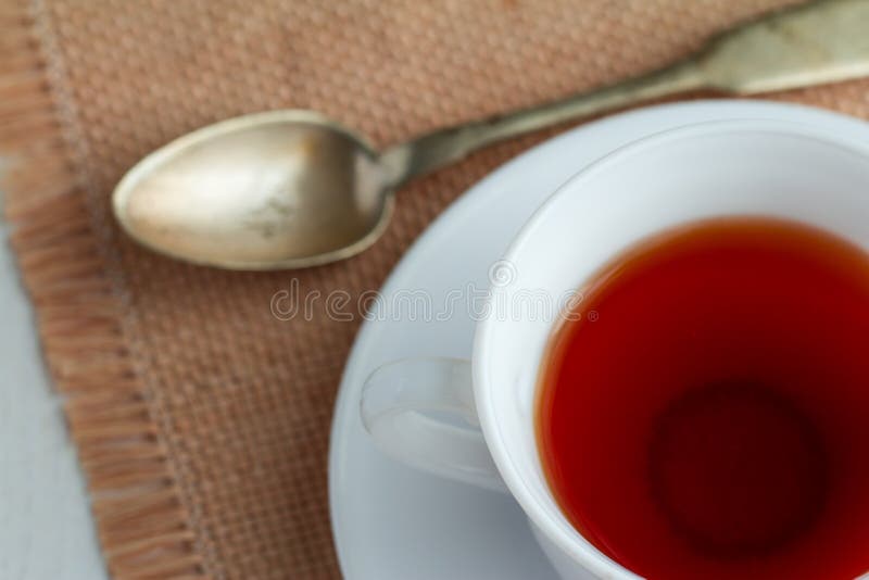 Cup of tea with teaspoon stock photo. Image of anise - 69980826