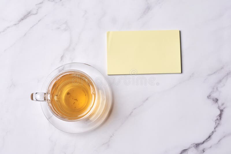 A Cup of Tea and a Yellow Note on a Stock Photo - Image of table, close ...