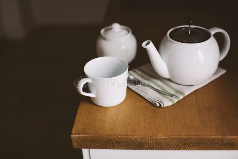 Cup, Teapot on Kitchen Table Stock Photo - Image of handle, liquid ...