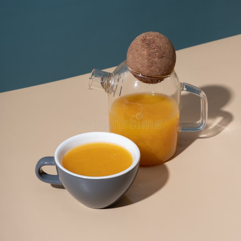 Cup and Teapot of Sea Buckthorn Tea. Minimalistic Still Life ...