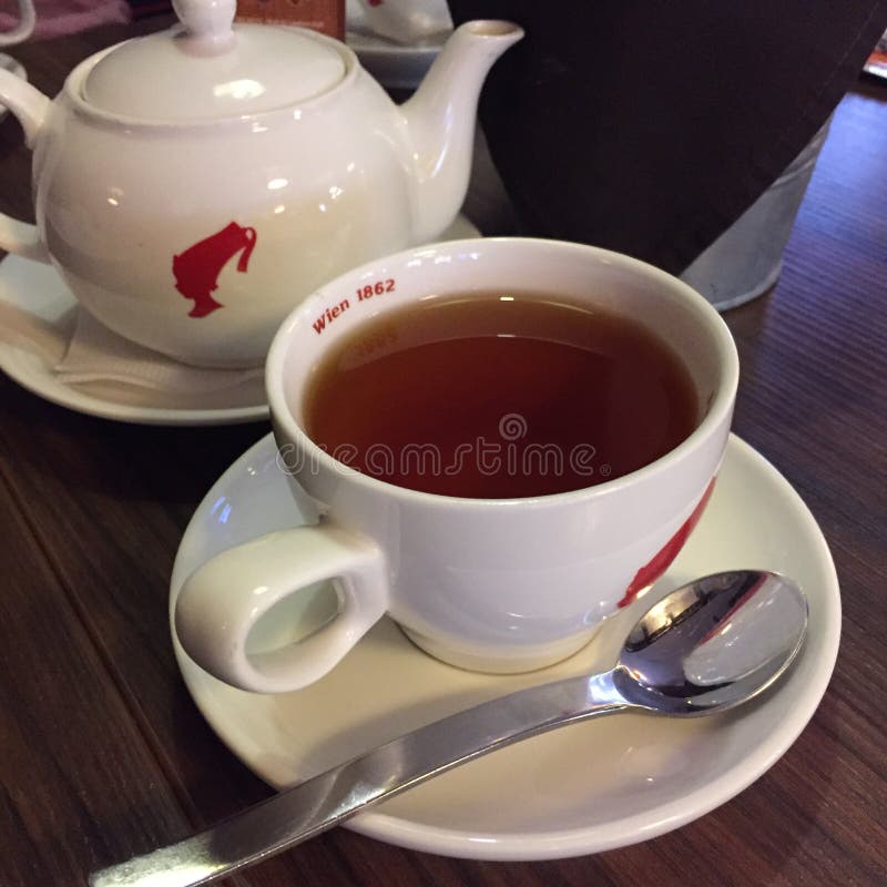 A cup of tee and teapot editorial photography. Image of conversation ...