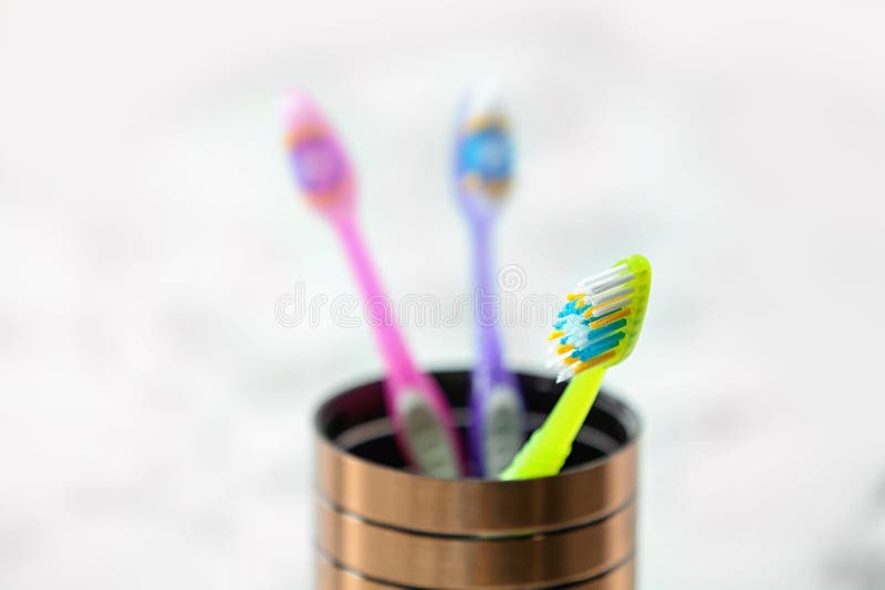 Cup with Toothbrushes on Table, Closeu Stock Image - Image of object ...