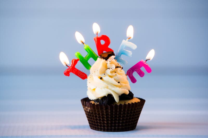 Cupcake with a Candles for 3 - Third Birthday Stock Photo - Image of ...