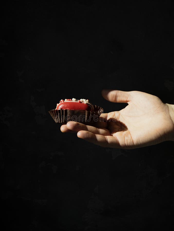 Cupcake in hand stock image. Image of sweet, patisserie - 254782627