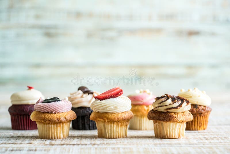 Cupcake on the old wooden stock image. Image of sugary - 84184109