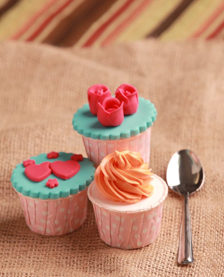 Cupcakes with Fondant Flowers Stock Photo - Image of decorating, bright ...