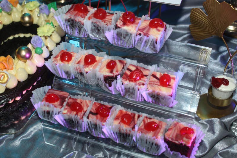 Cupcakes in Corporate Layer Table on White Linen with a Beautiful Event ...