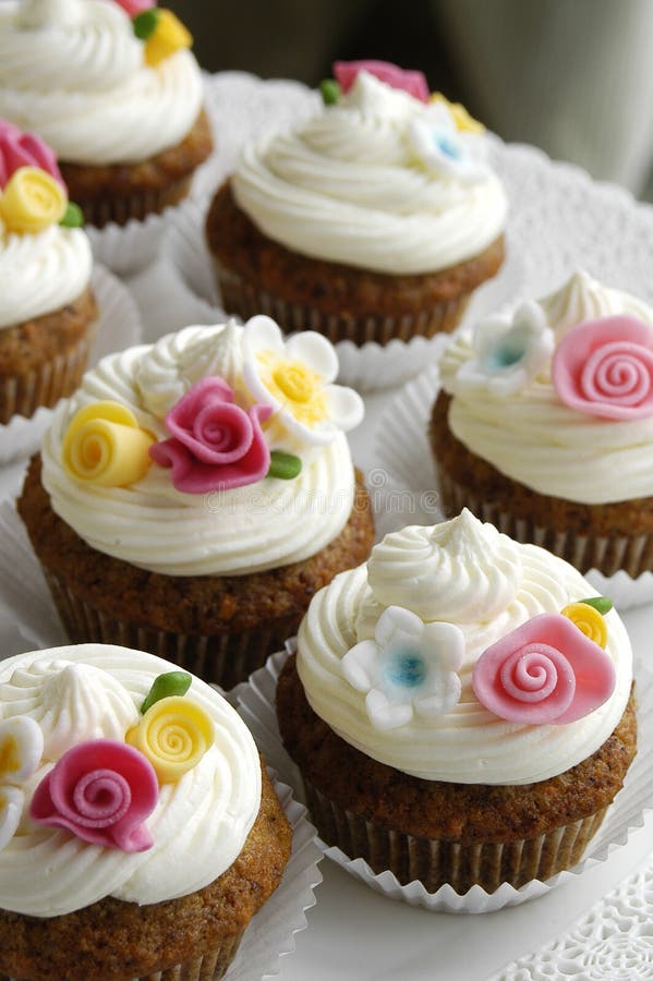 Cupcakes with Fondant Flowers Stock Photo - Image of decorating, bright ...