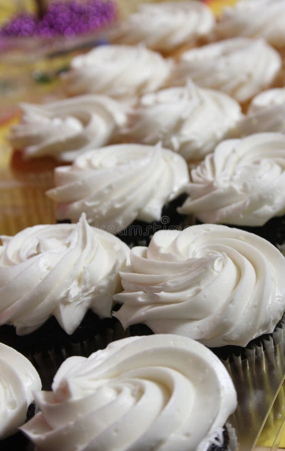 Cupcakes with White Icing on Table at Party or Event Stock Photo ...
