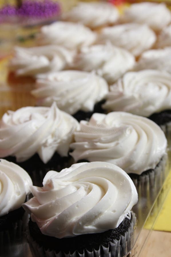 Cupcakes with White Icing on Table at Party or Event Stock Image ...