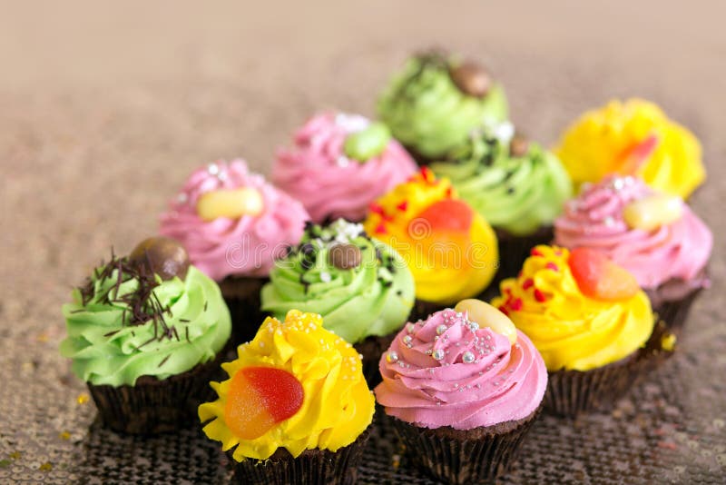 Cupcakes. Yellow, Green and Pink Cakes. Stock Photo - Image of ...