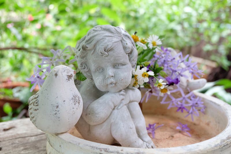Cupid and flowers stock photo. Image of face, peaceful - 72356076