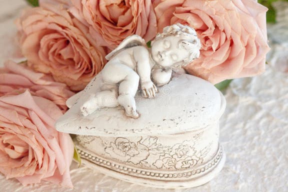 Cupid with Pink Roses stock photo. Image of valentines - 17406402