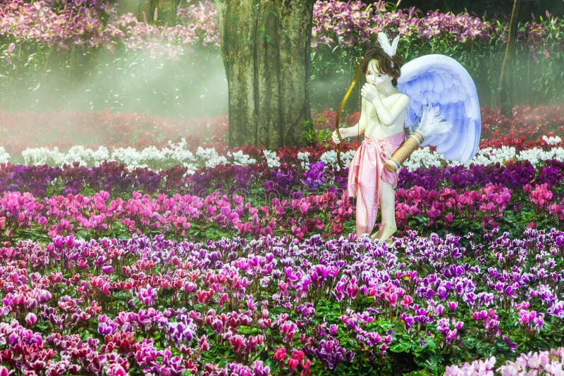 Cupid Stand on the Flower Garden Stock Photo - Image of holiday, floral ...